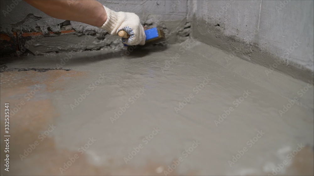 Waterproofing coating. Cover the concrete wall with a cement-polymer ...