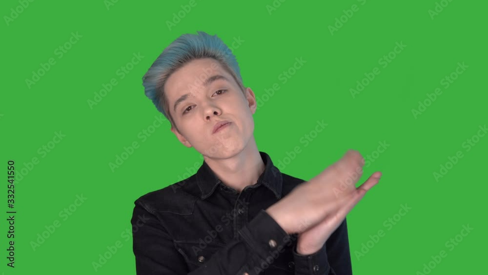 Sarcastic young man clapping hands looking at camera green screen ...