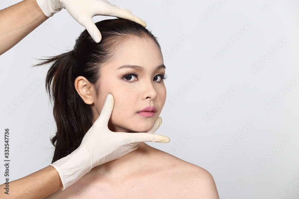 Asian Beautiful Woman diagnose face skin structure and prepare to ...