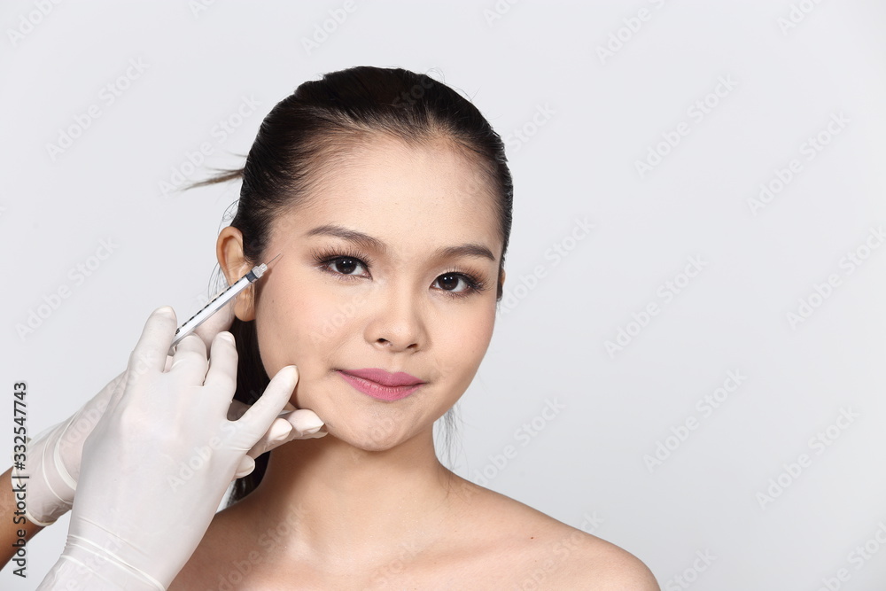 Asian Beautiful Woman diagnose face skin structure and prepare to ...