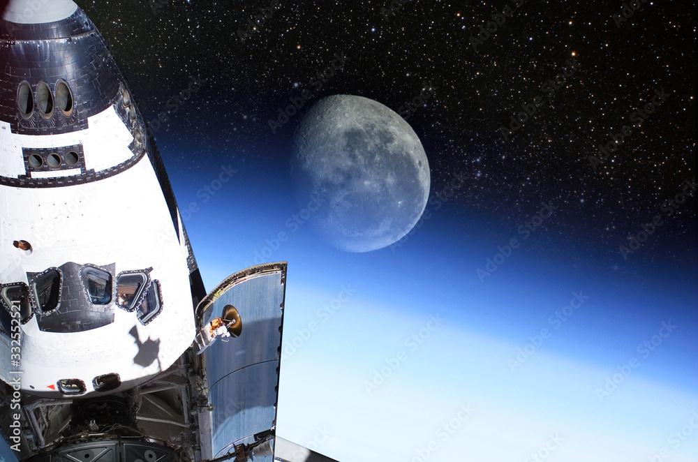 Space Shuttle orbiting the earth. Elements of this image furnished by ...