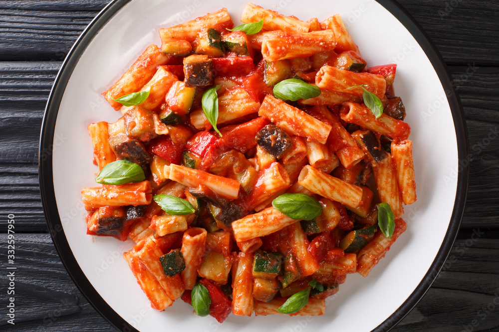 talian Pasta Tortiglioni with eggplant, zucchini, pepper and basil in ...