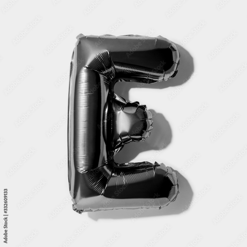 Letter E, Black foil balloon alphabet isolated on white background with ...