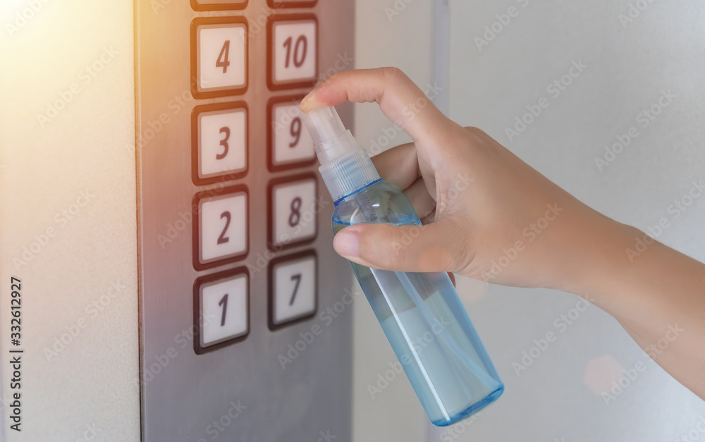 disinfect, sanitize, hygiene care. people using alcohol spray on ...