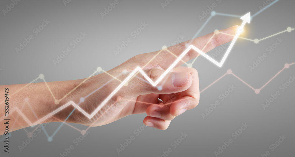 Hand touching graphs of financial indicator and accounting market ...