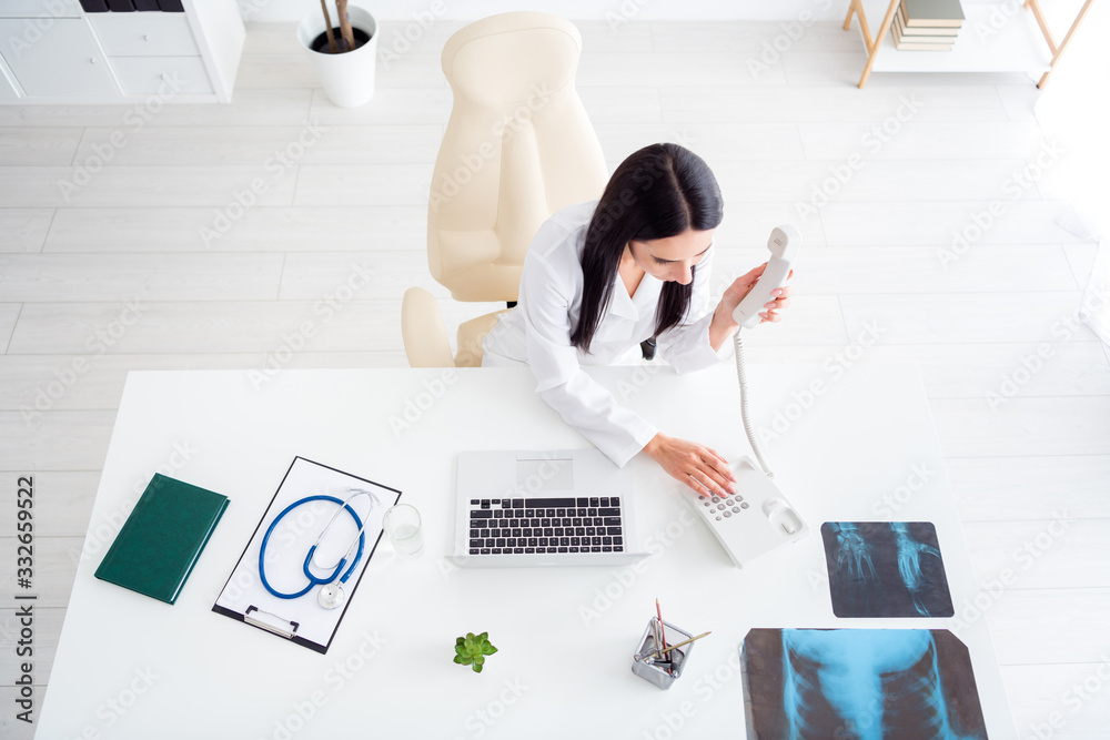 High angle top above view photo of doc radiologist lady hold landline ...