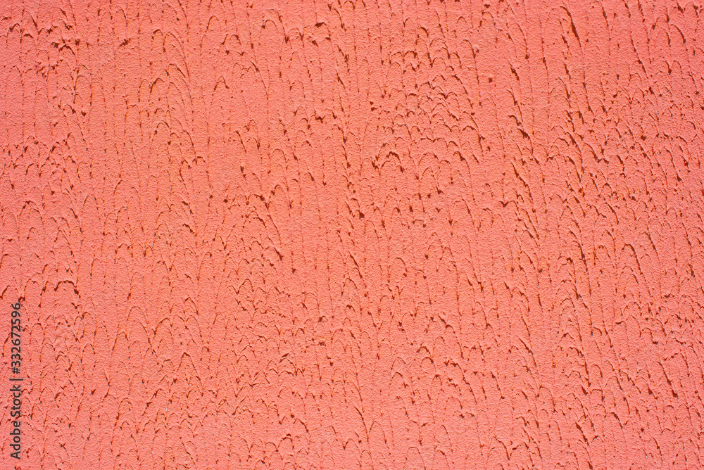 Coral plaster wall. Uneven texture of putty on the wall with copy space ...