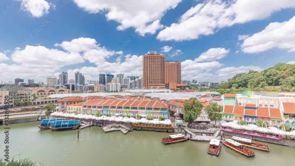 Vidéo Stock Tourist boats docking at Clarke Quay habour aerial ...