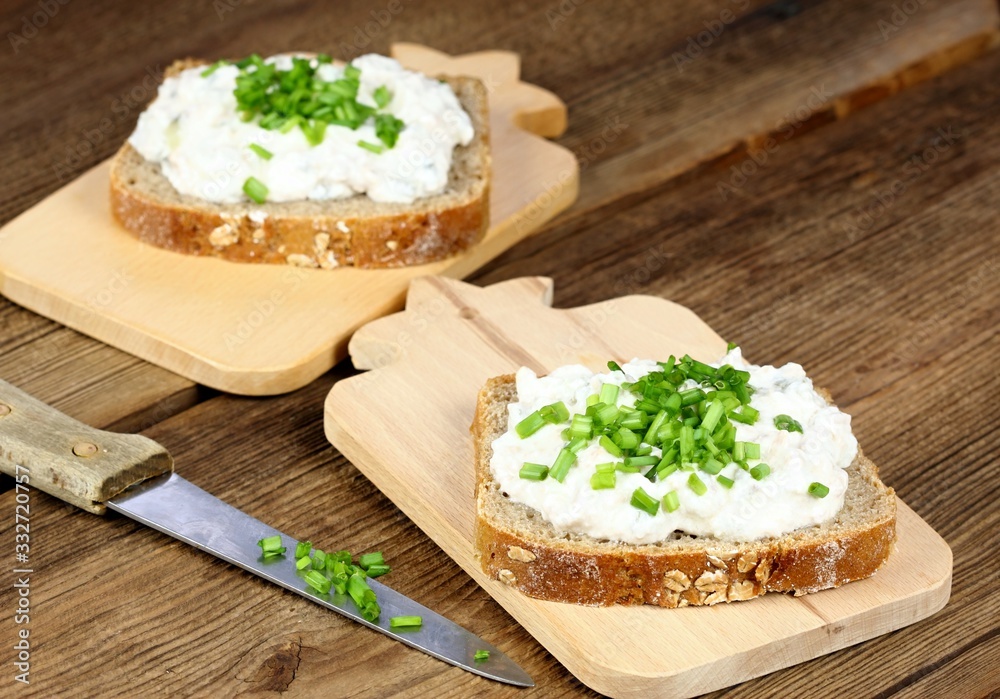 Cod liver pate over brown bread with spring green onion. Homemade ...