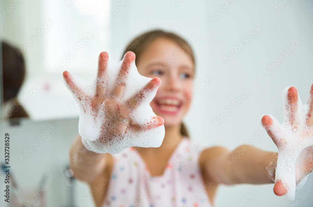 Little girl washing hands with water and soap in bathroom. Hands ...