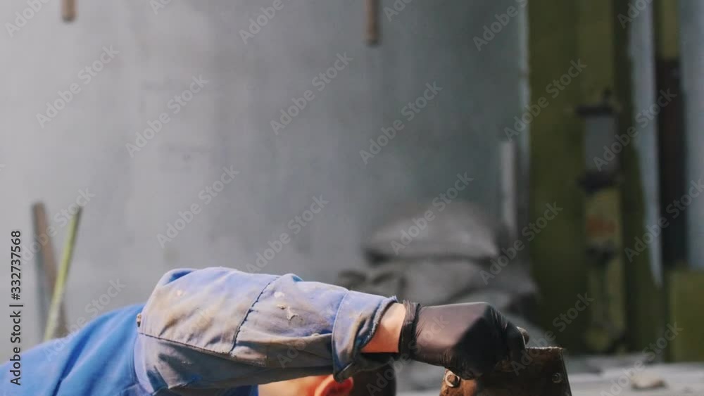Concrete industry - man worker putting concrete in the cone form in the ...