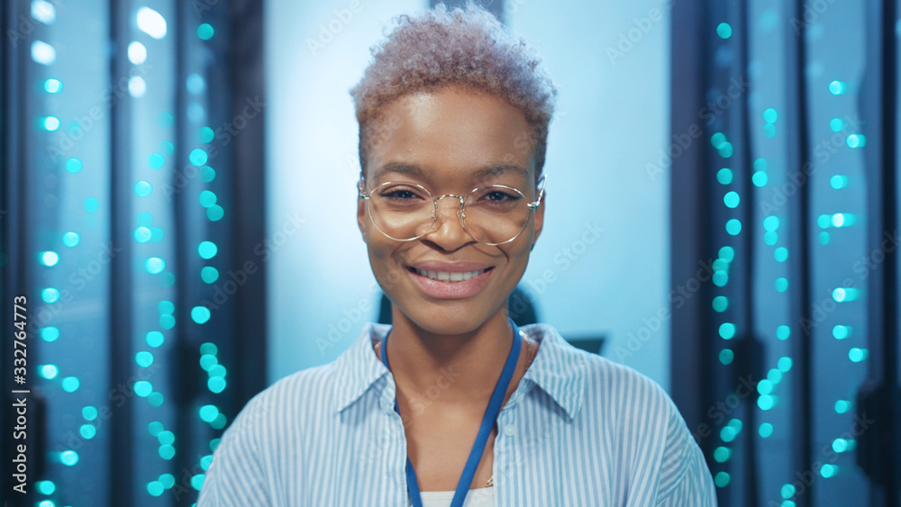 Attractive positive african female IT specialist wearing glasses ...