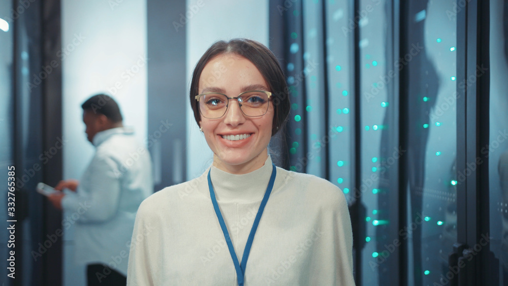 Young attractive woman IT engineer with tablet smiling at camera ...