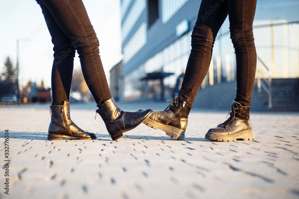 Legs greetings of two girls during coronavirus epidemia to avoid the ...