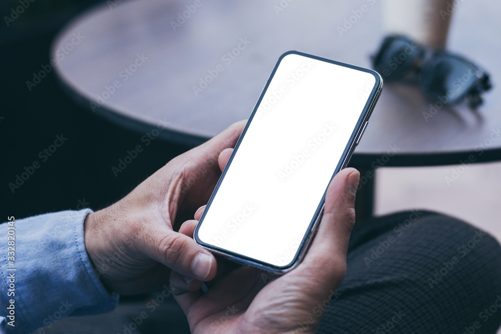 Mockup image blank white screen cell phone.man hand holding texting ...