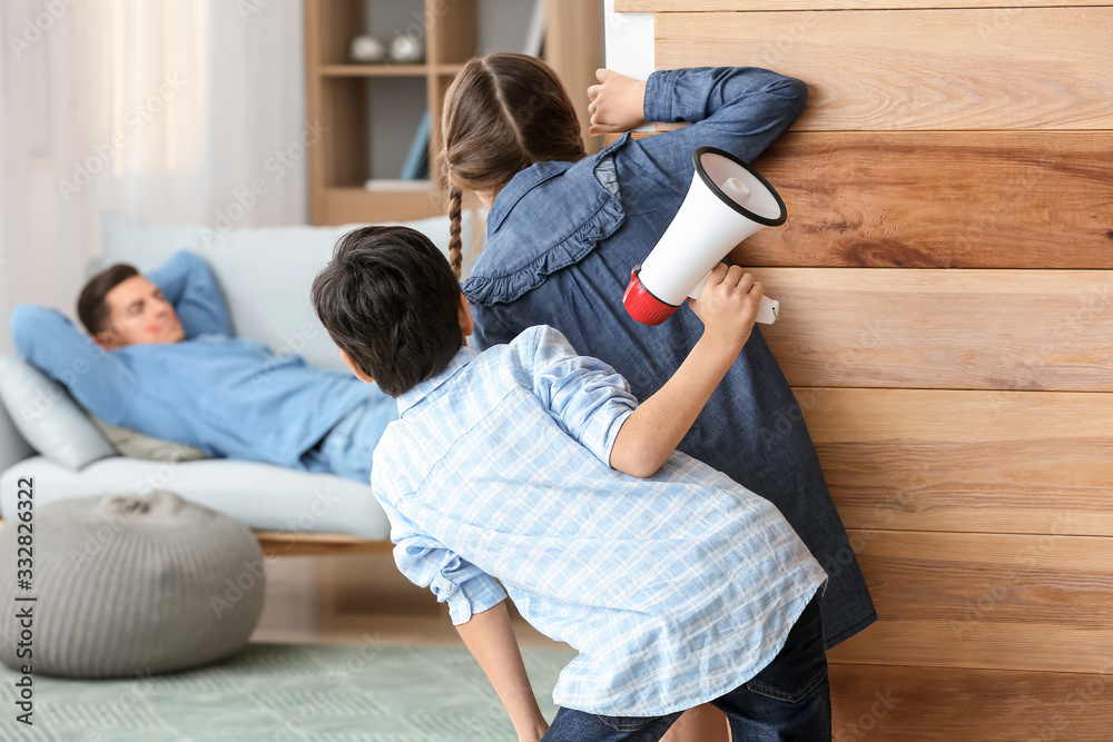 Poster Children playing a prank on their father at home – Wall Art ...
