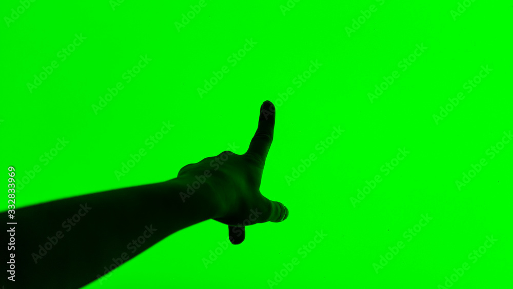 The person points at the green screen of the touchscreen monitor ...