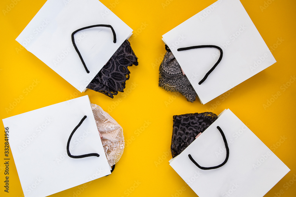 Paper craft package with purchases of women's clothing from which the ...