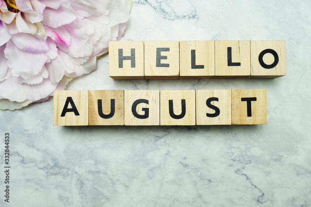 Hello August alphabet letters with pink flower decoration on marble ...