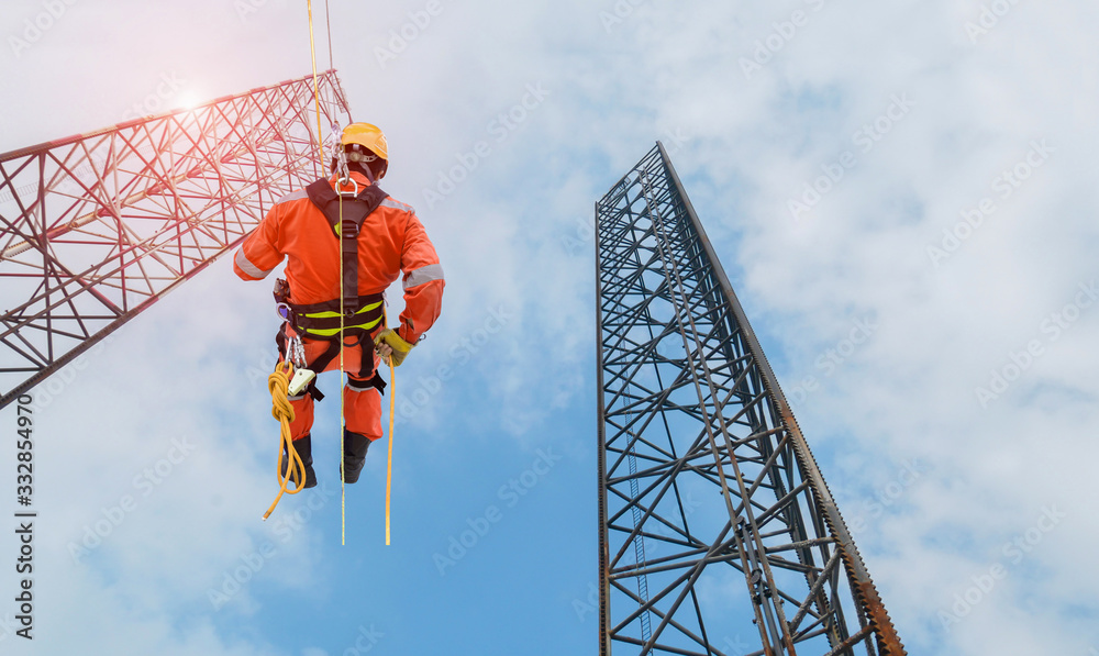 rope access, Safety, Worker Demonstration the Abseiling of high wear ...