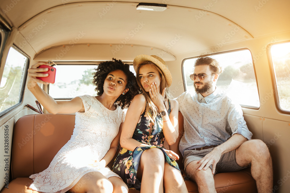 Three best friends travel in a minivan bus and explore new places. Two ...