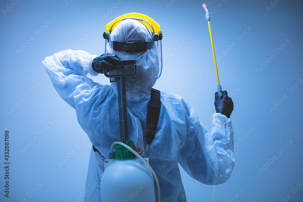 Scientist holding chemical sprayer for sterilization and ...