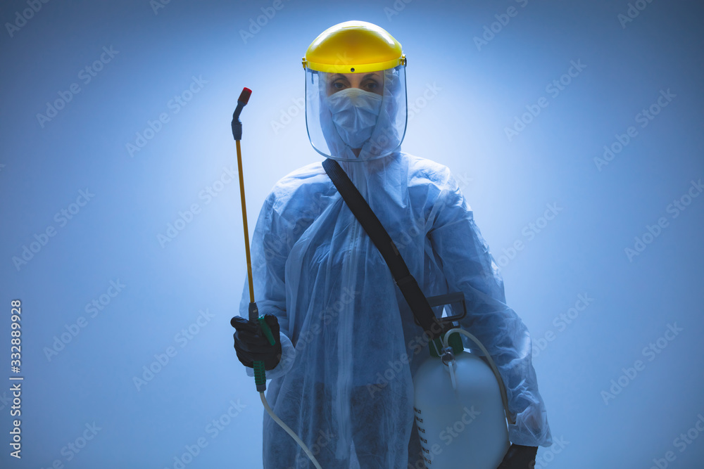 Scientist holding chemical sprayer for sterilization and ...