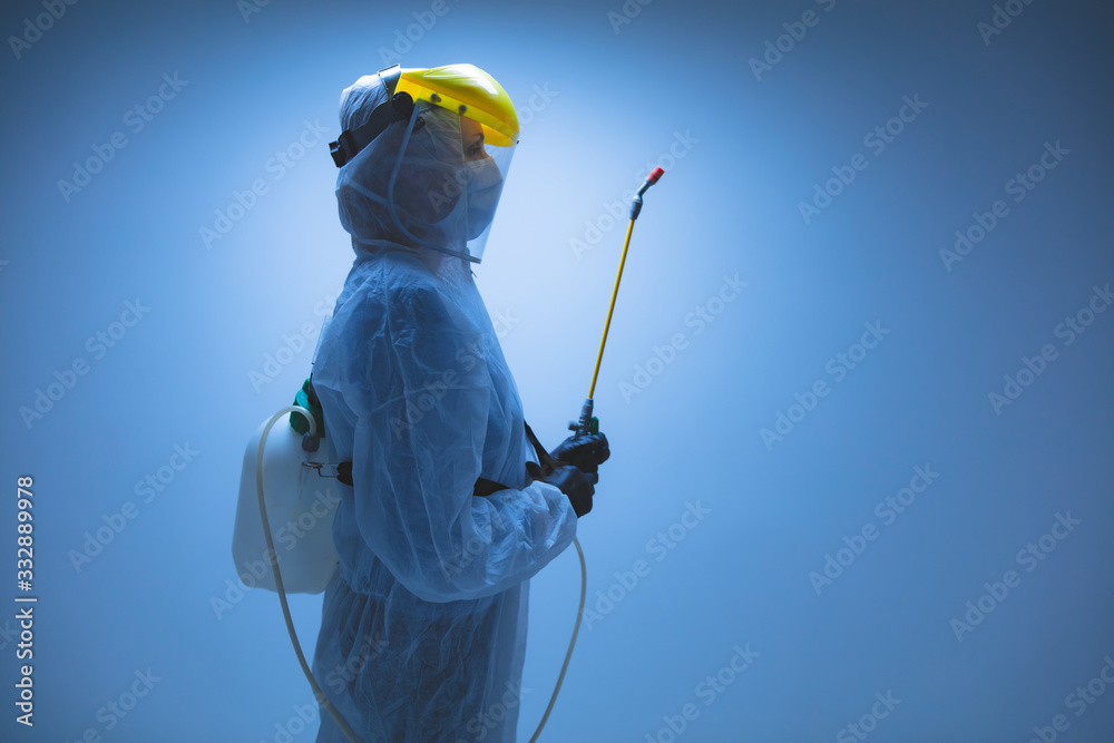 Scientist holding chemical sprayer for sterilization and ...