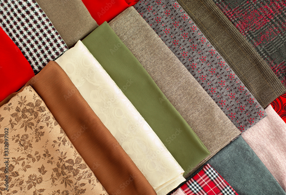The fabric is layered and creates a background. Fabric of different ...