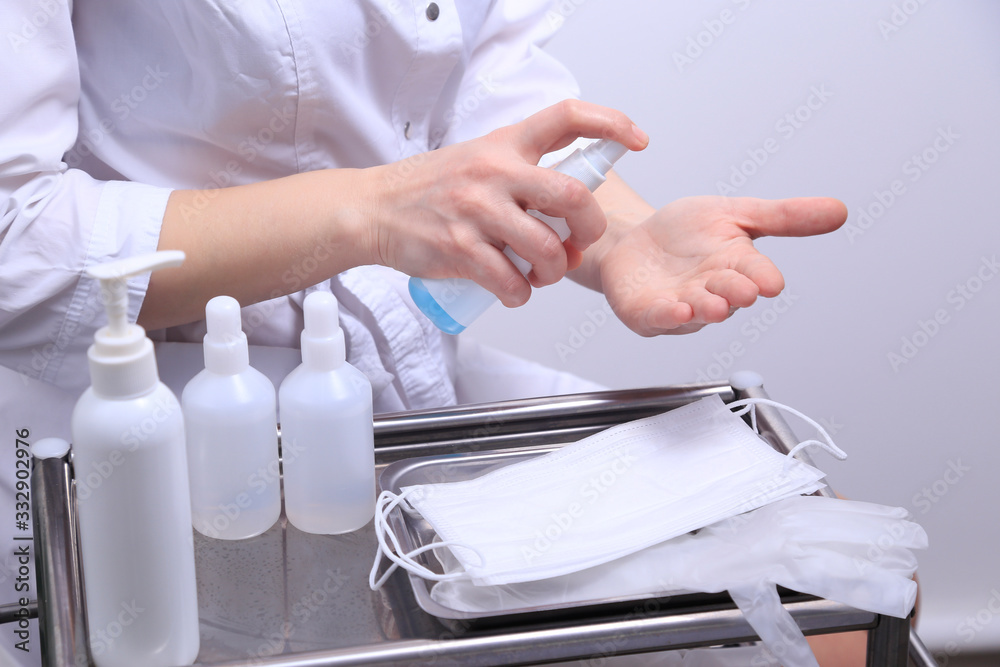 Nurse sanitizes hands Coronavirus (Covid-19) quarantine, alcohol spray ...