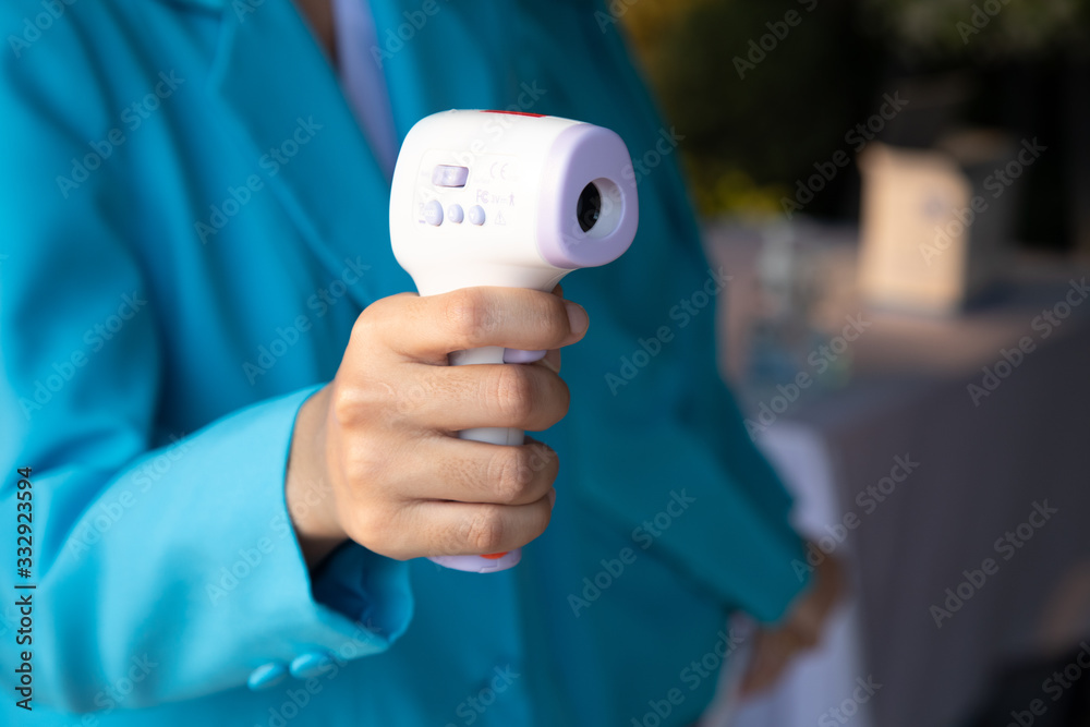 Nurse scan measure the fever by infraled thermometer protect covid-19 ...