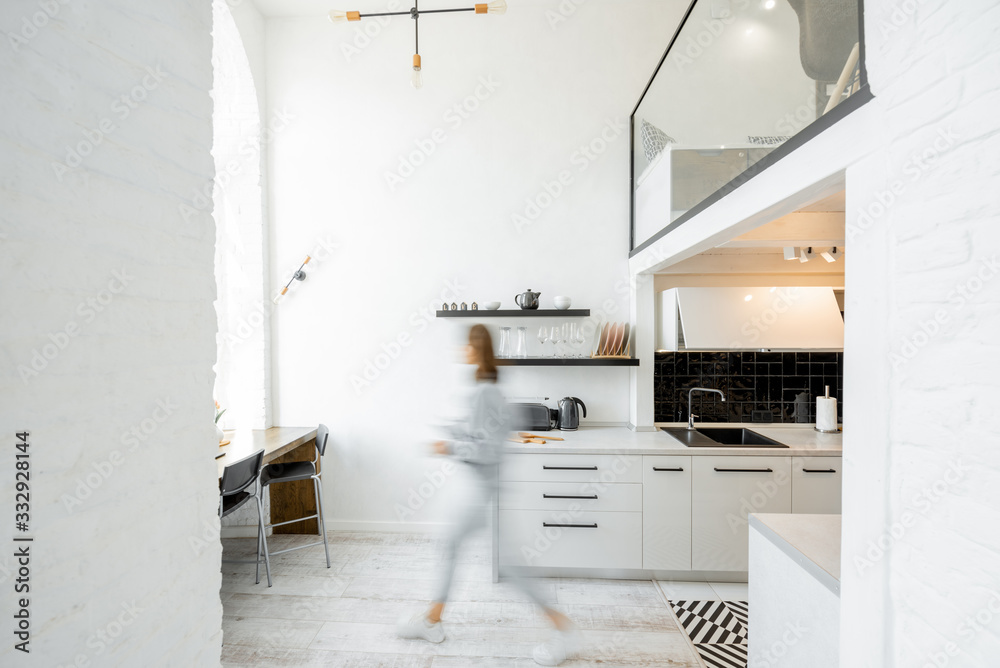 Interior view of the bright and modern kitchen with a blurred in motion ...