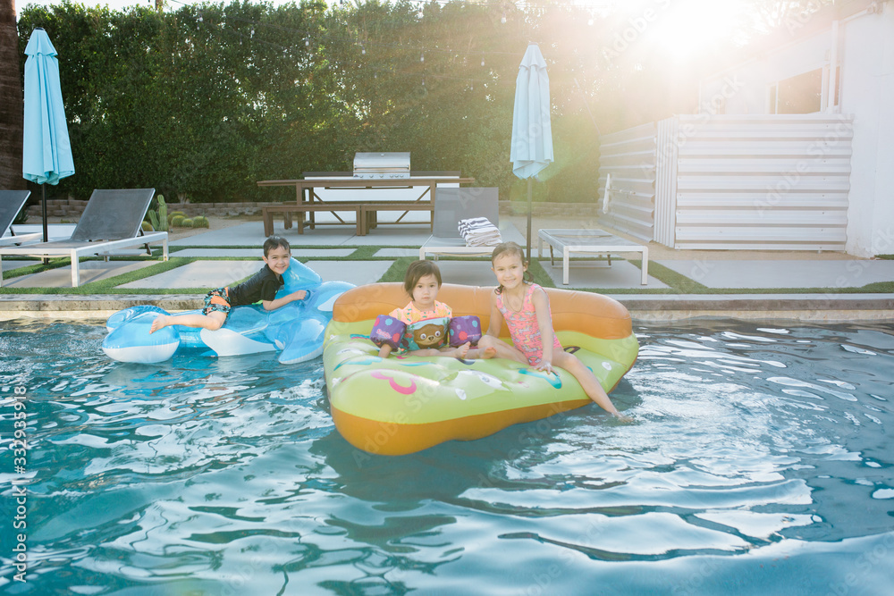 Kids Playing in Swimming Pool Stock Photo | Adobe Stock
