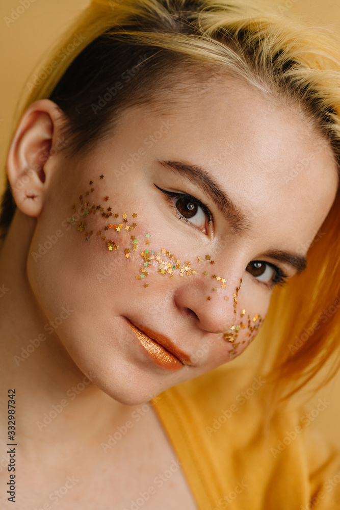 Girl with yellow stars like freckles on her cheeks Stock Photo | Adobe ...