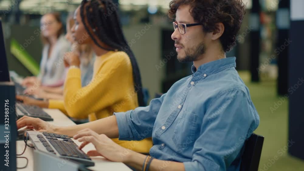 University Library: Handsome Bright Boy using Computer for Class ...