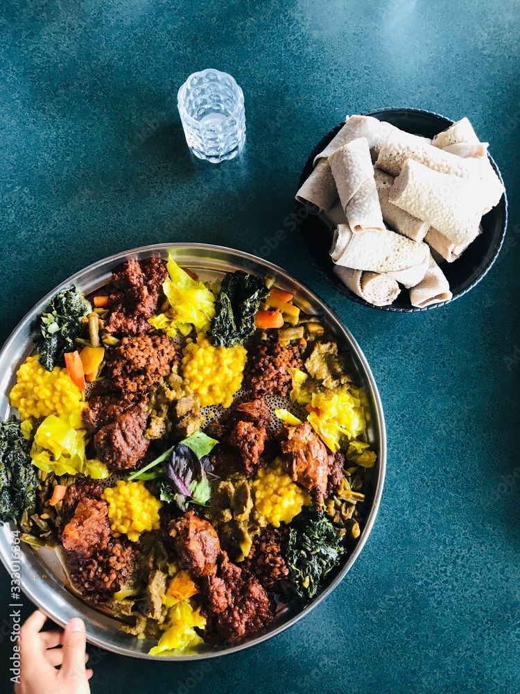 Ethiopian food platter with injera bread rolls Stock Photo | Adobe Stock
