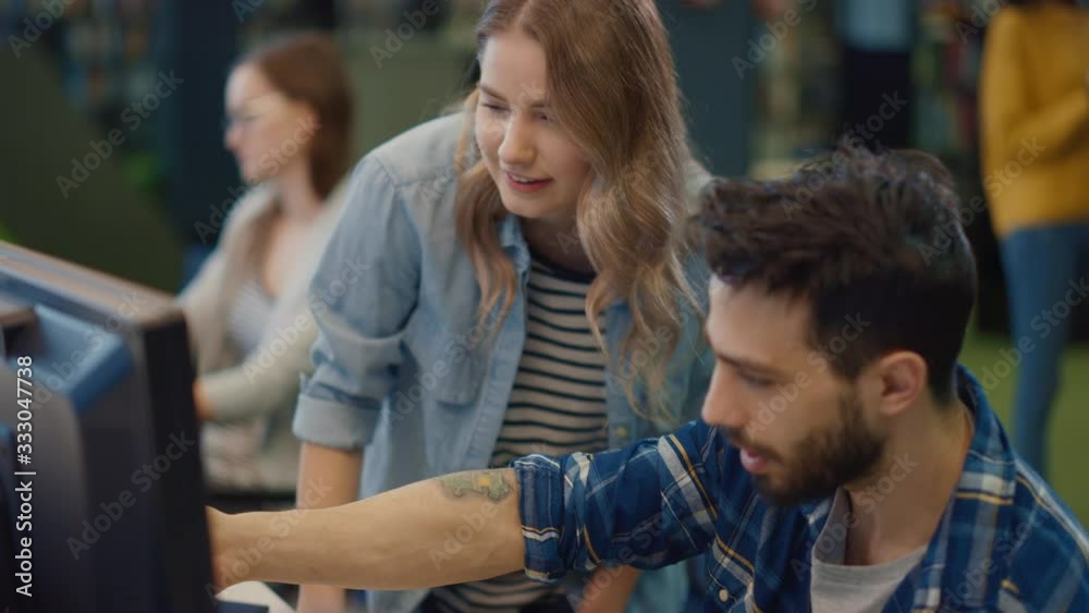 Row of Diverse Group of Multi-Ethnic People Works on Personal Computers ...
