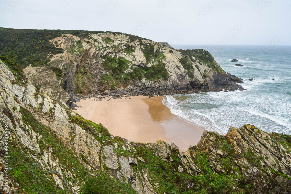 Adegas beach, in Aljezur, Portugal. Naturism beach surrounded by cliffs ...