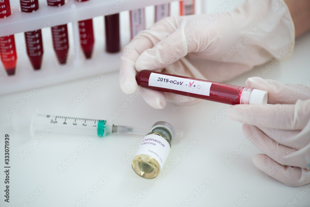 Test tubes with blood sample Covid-19 coronavirus. Vaccine and syringe ...