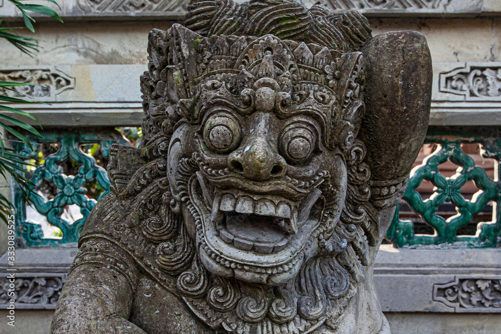 Traditional stone statues depicting demons, gods and Balinese ...