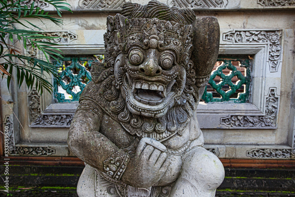 Traditional stone statues depicting demons, gods and Balinese ...