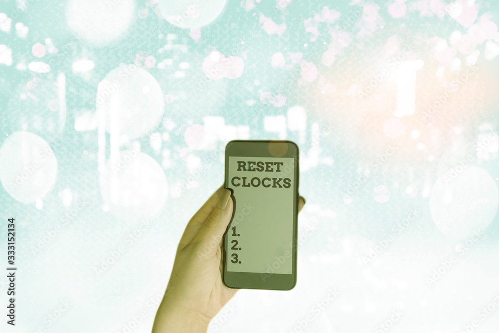 Writing note showing Reset Clocks. Business concept for To revisit ...