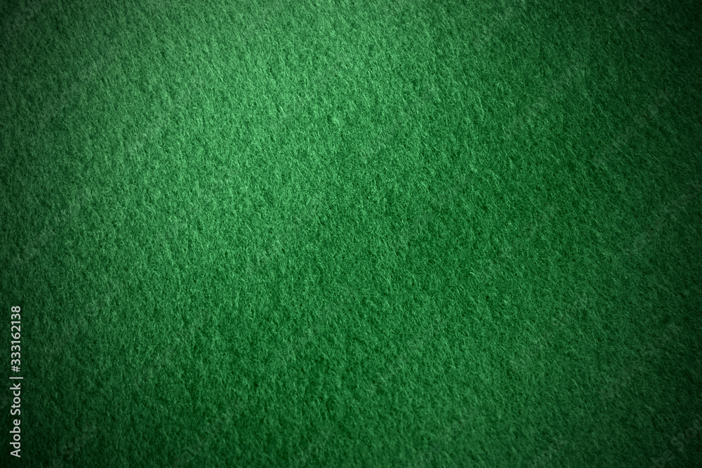 Poker table felt background in dark green color with shade vignette ...