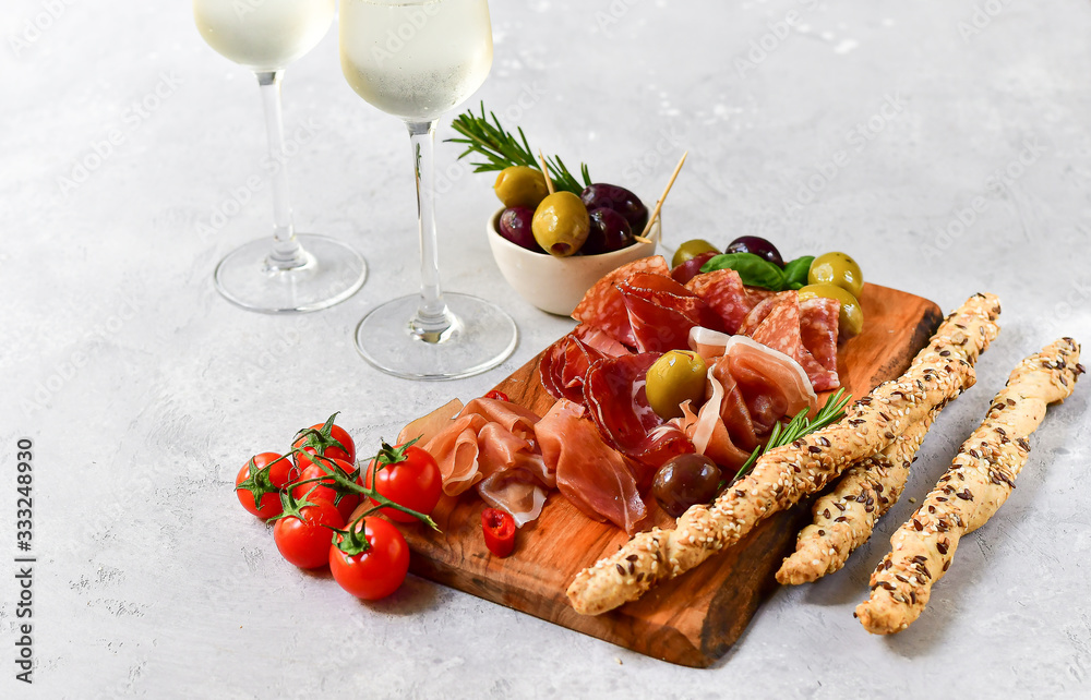 Traditional Italian appetizers antipasto : salami, bresaola, prosciutto ...