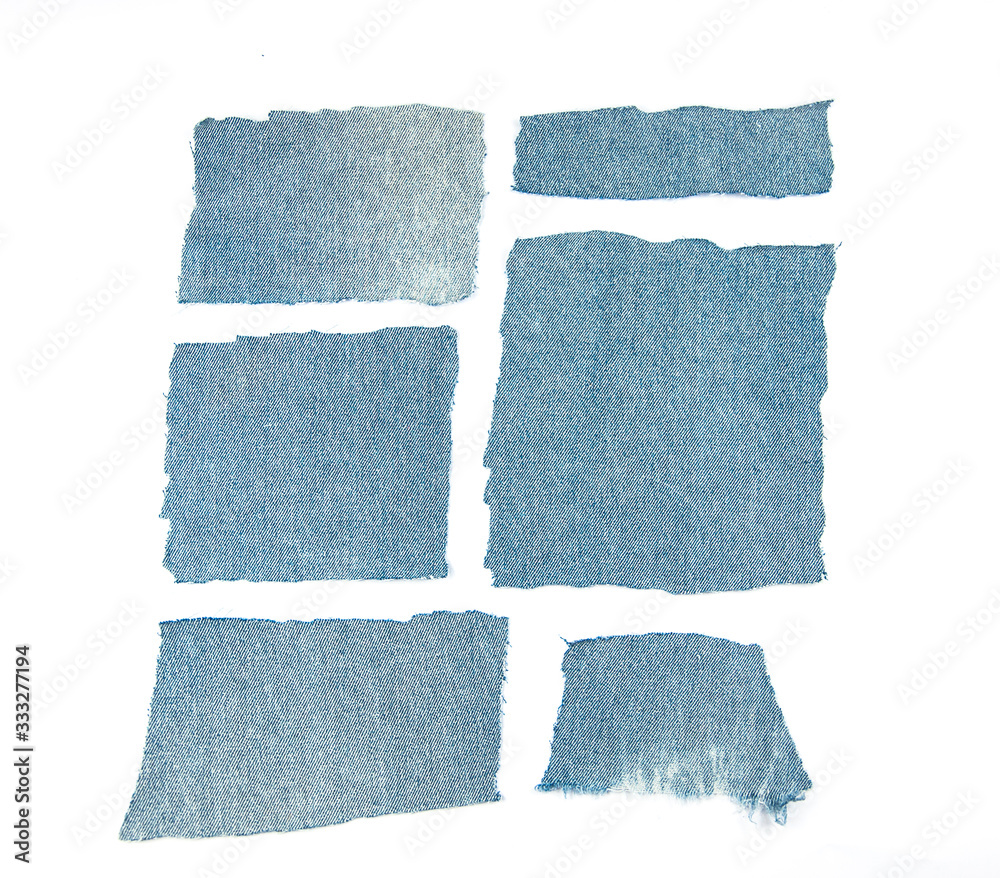 Destroyed torn denim blue jeans frayed flap patch fabric frame on white ...