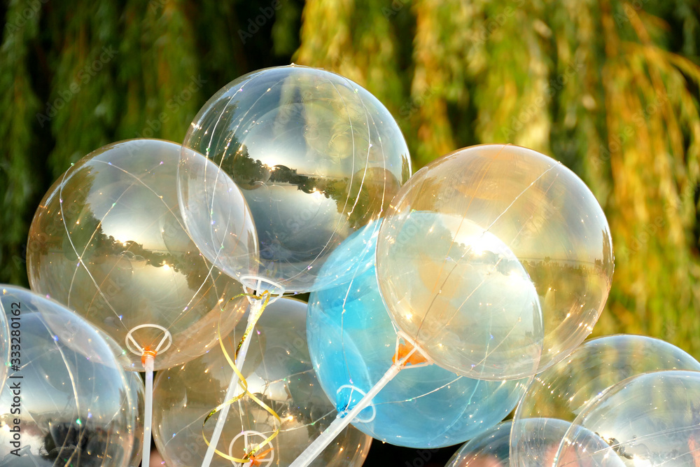 festive transparent helium balloons in the open space. helium balloons ...