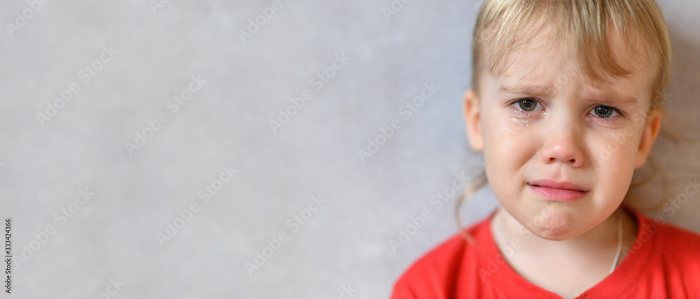 kid crying. the face of a cute little upset four year old baby boy in ...