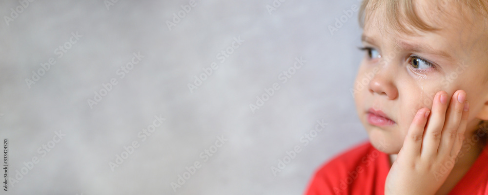 kid crying. the face of a cute little upset four year old baby boy in ...