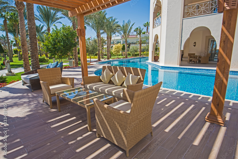 Table by a swimming pool of luxury hotel resort room Stock Photo ...