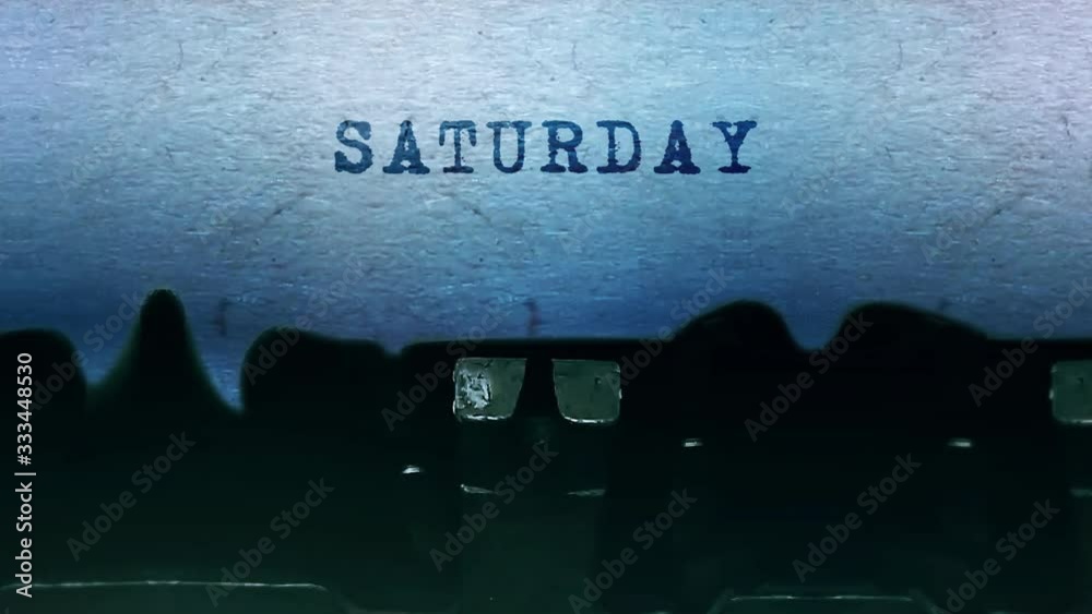 SATURDAY Word closeup Being Typing and Centered on a Sheet of paper on ...